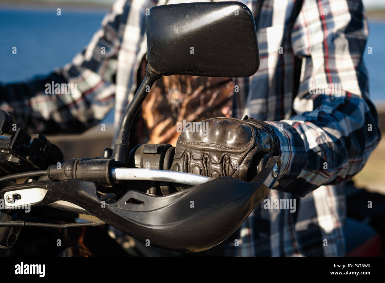 Close-up view on hands on handlebars Stock Photo - Alamy
