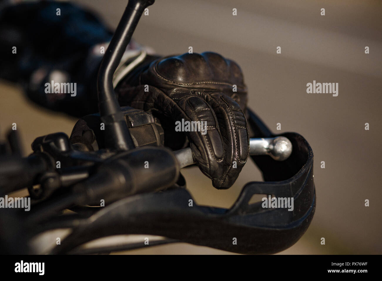Close-up view on hands on handlebars Stock Photo - Alamy