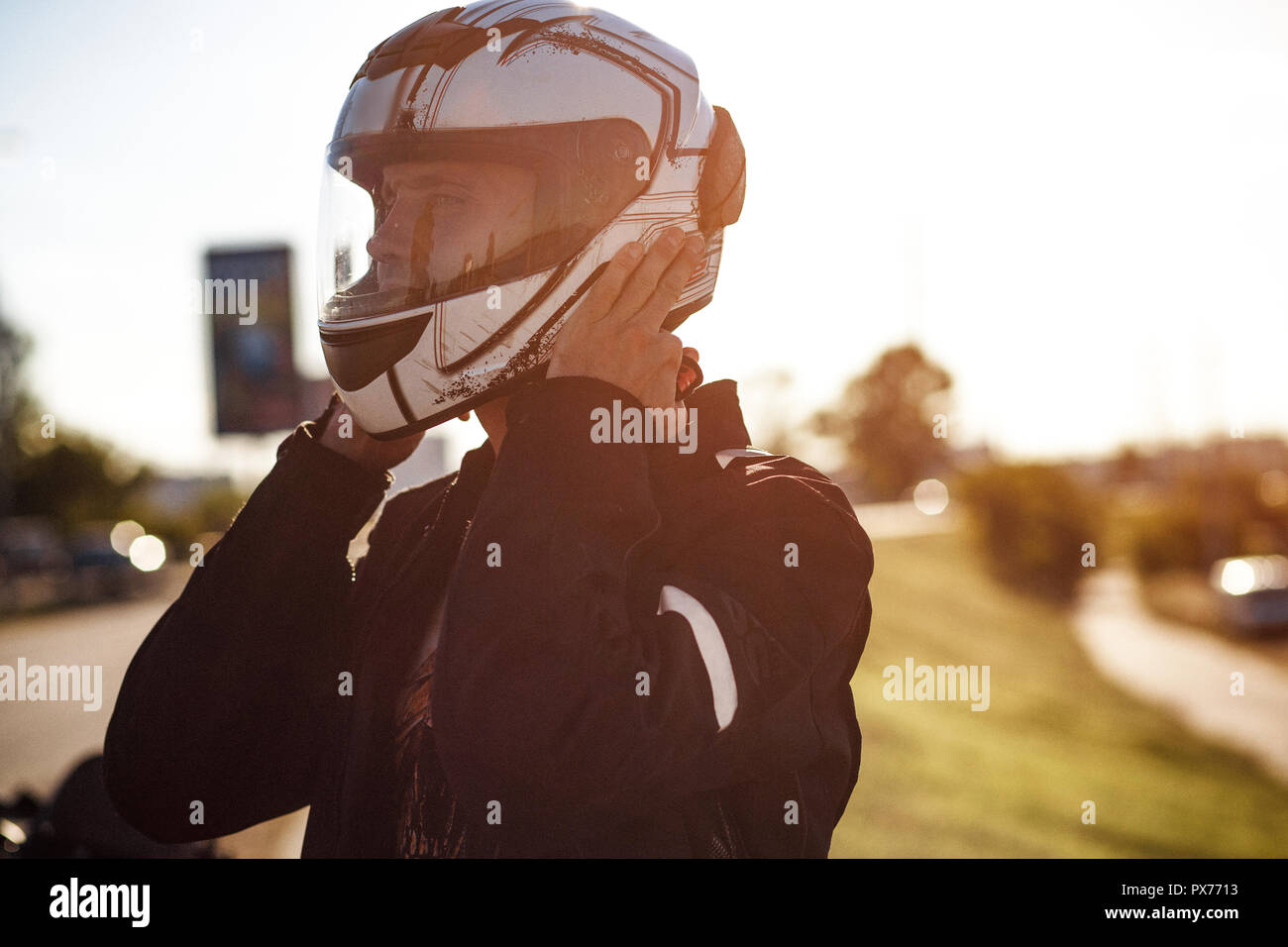 Wearing a helmet Stock Photo - Alamy