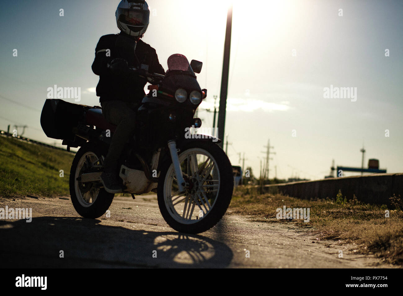 Side view of a biker on the motorbike Stock Photo - Alamy
