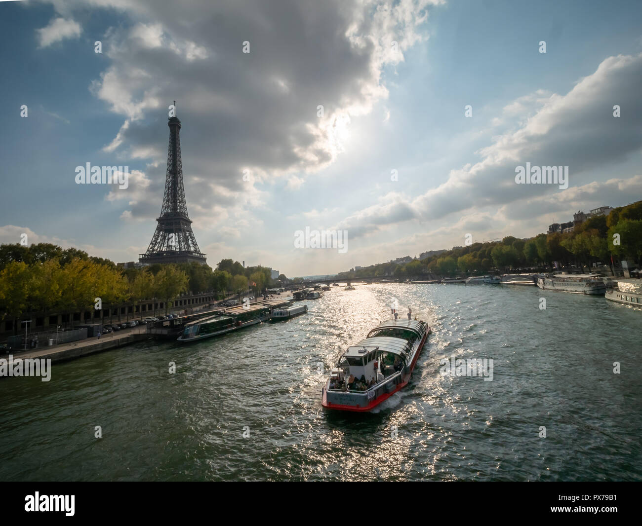 View of Tourist River Boat on the Siene River with the Eiffel Tower in ...