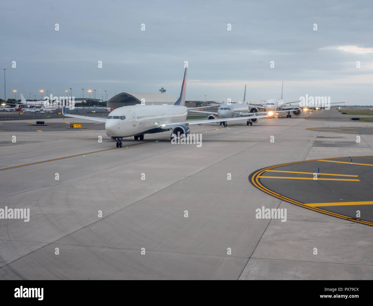 Multiple Airplanes Awaiting to Take off on Early Morning Stock Photo ...