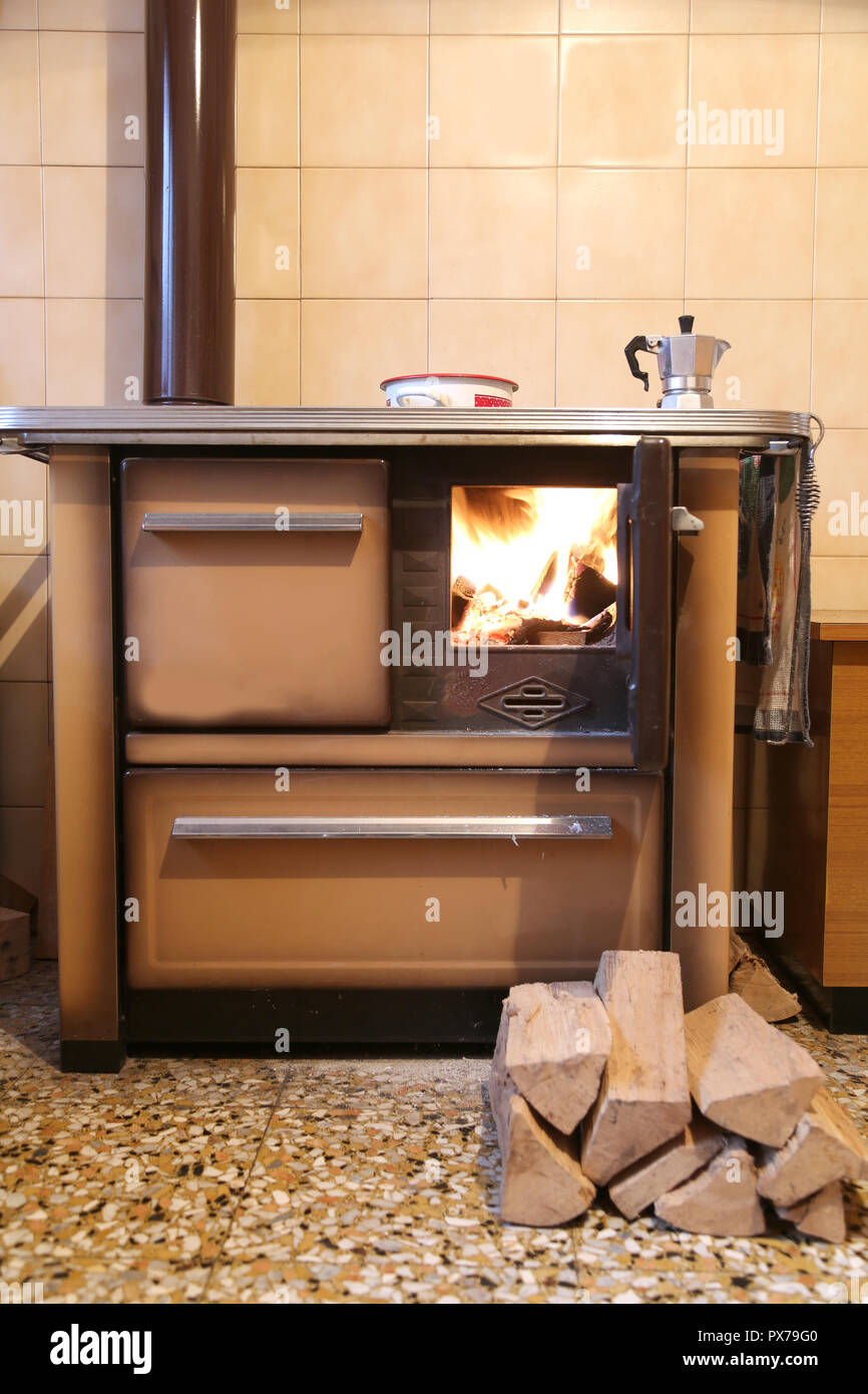 red fire lit in a stove with wood to burn out Stock Photo - Alamy