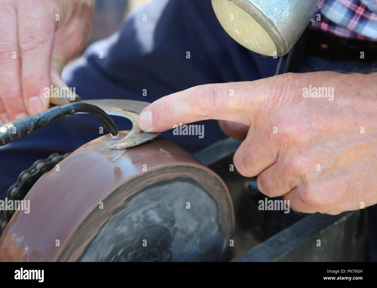 Hand old man grinds sharpening hi-res stock photography and images - Alamy