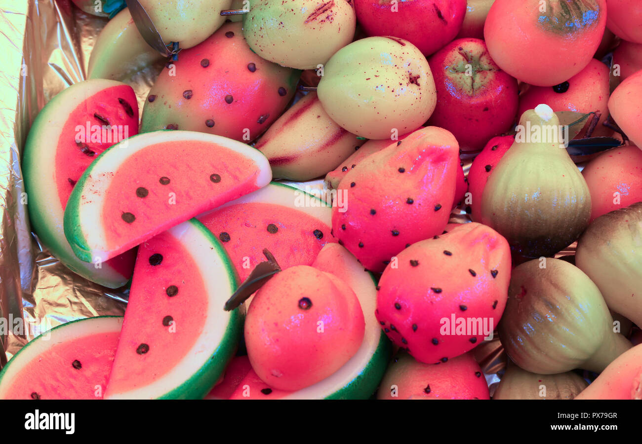 watermelons, kiwis and marzipan persimmons for sale in a candy store ...