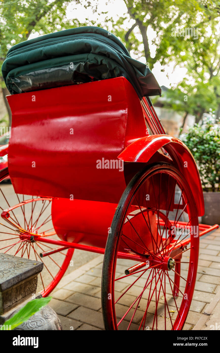 A bright red rickshaw in a back alley in a Beijing hutong - 3 Stock ...