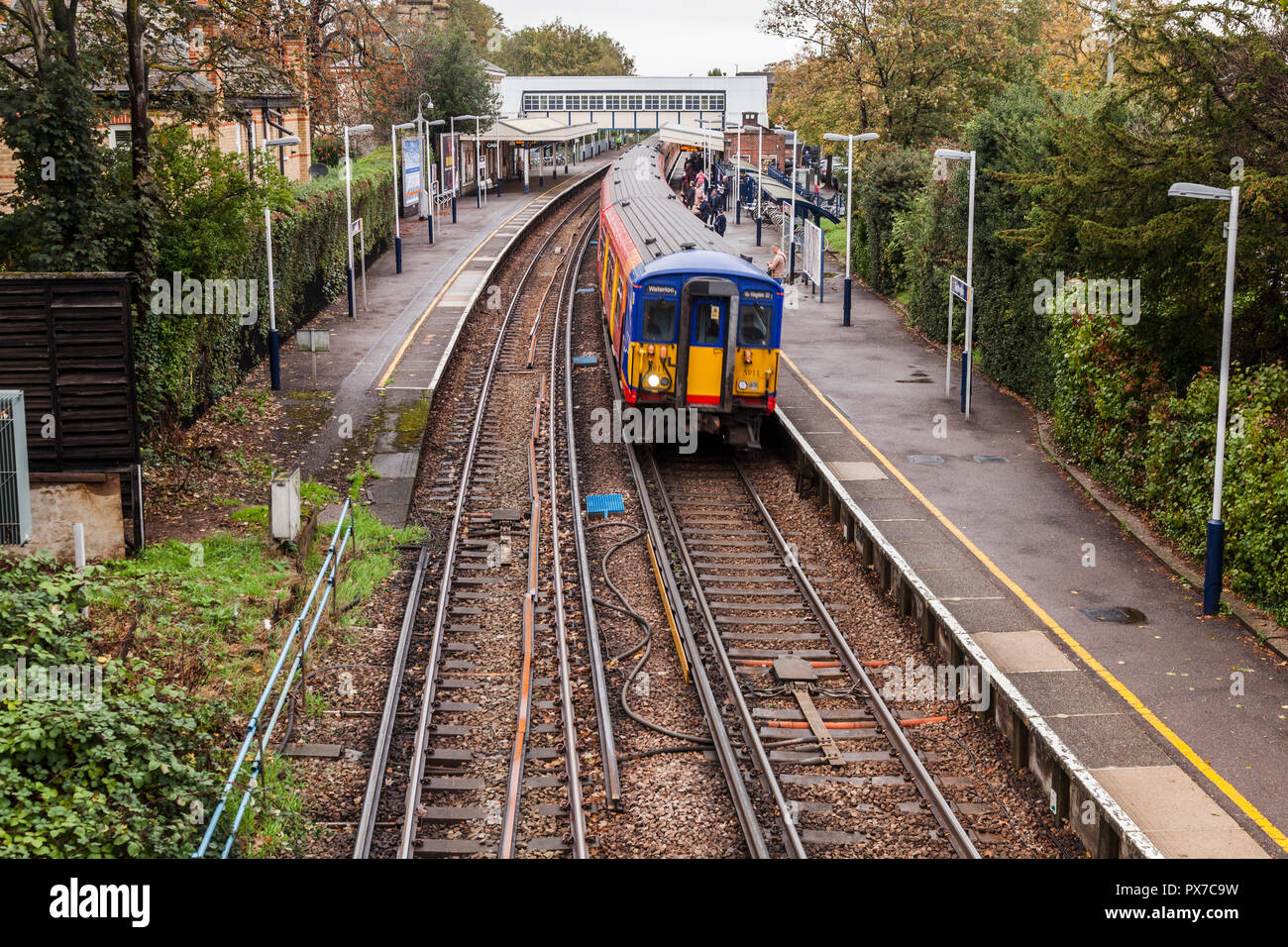A train leaving the station at Teddington,England,UK Stock Photo - Alamy