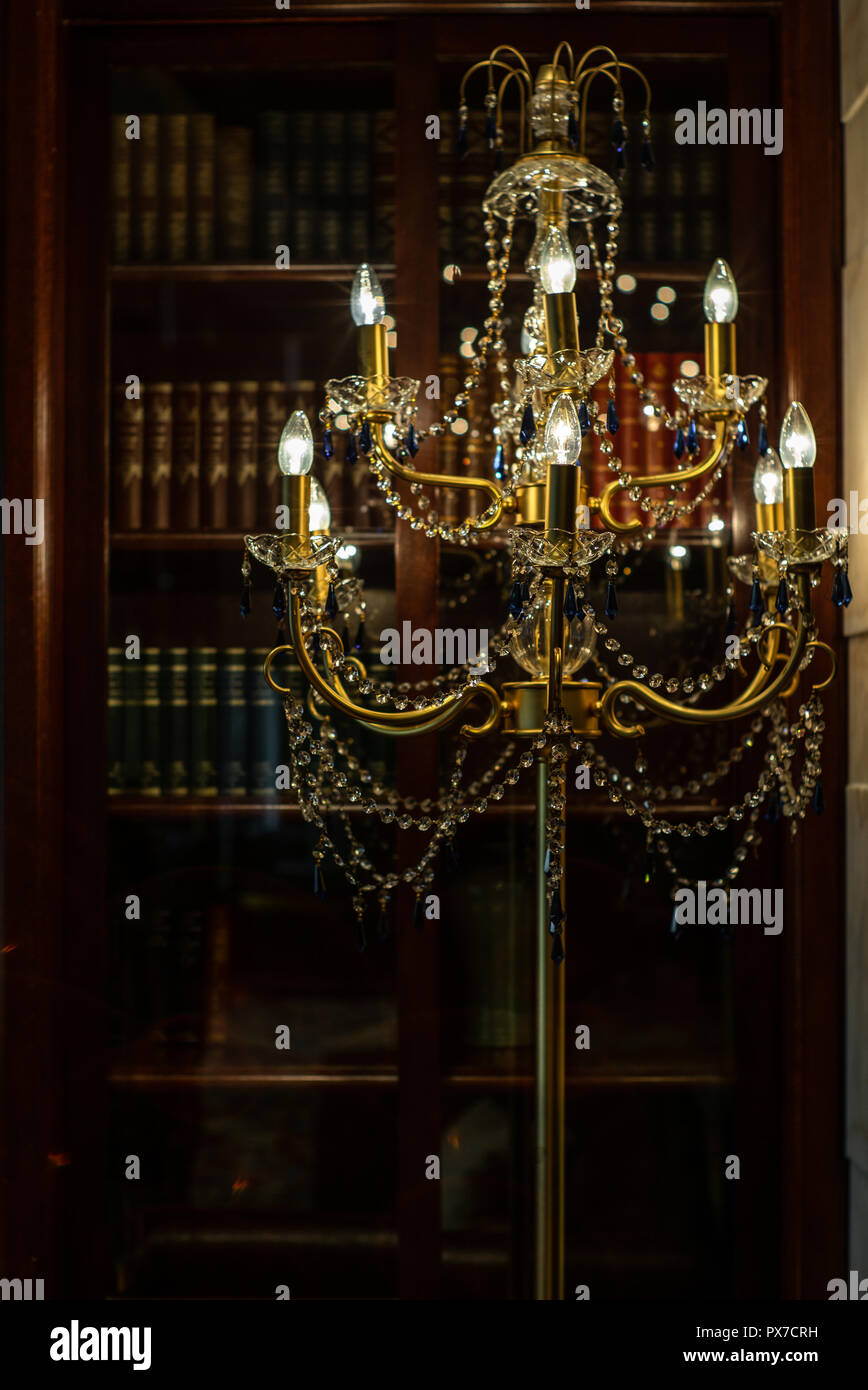 A classic British design crystal chandelier in a library - 2 Stock ...
