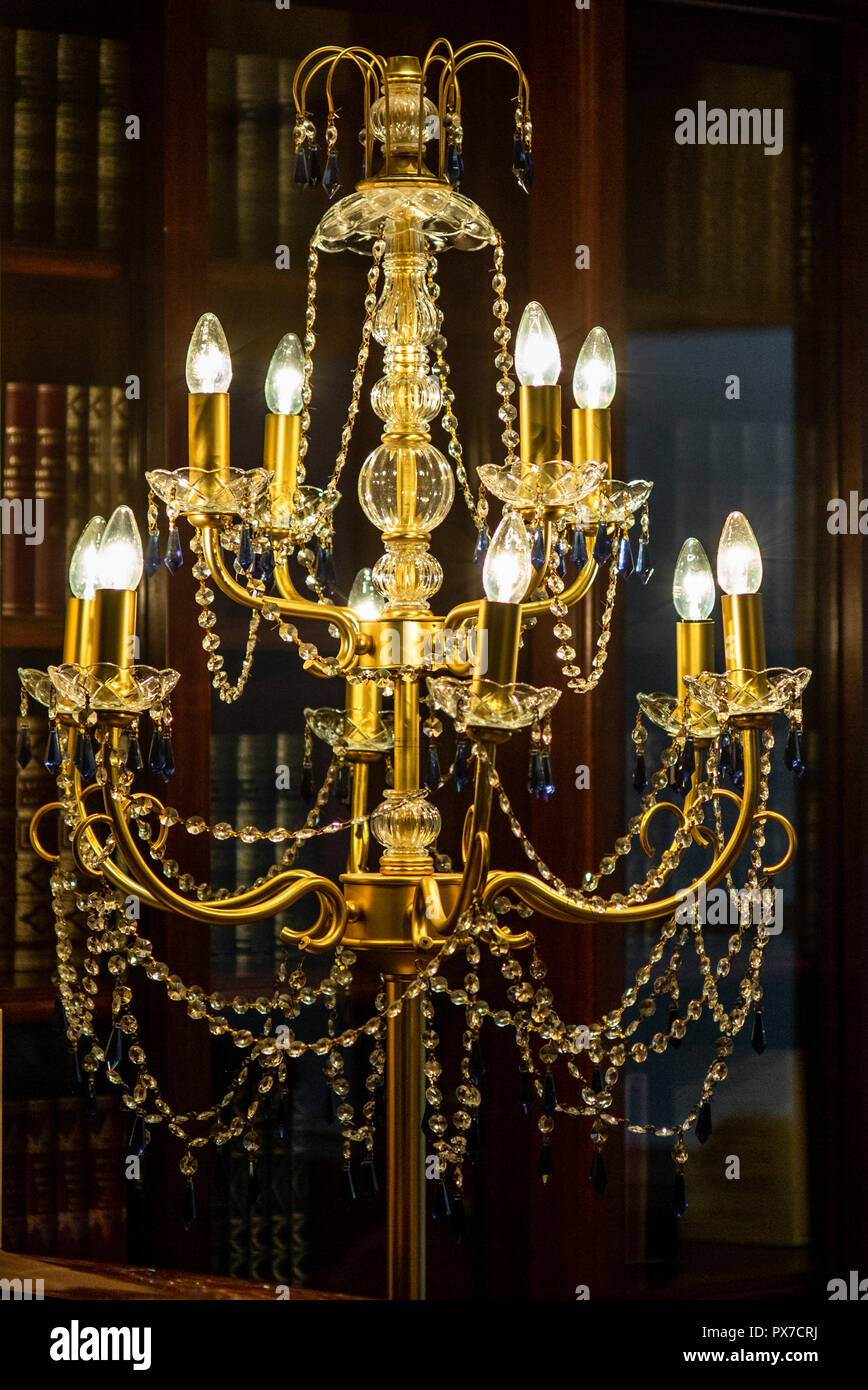 A classic British design crystal chandelier in a library - 3 Stock ...