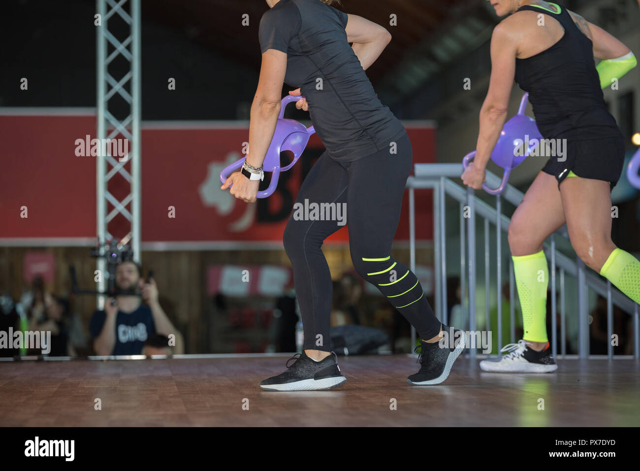 Fitness Teachers on Stage Moving with Gym Dumbbell Stock Photo - Alamy