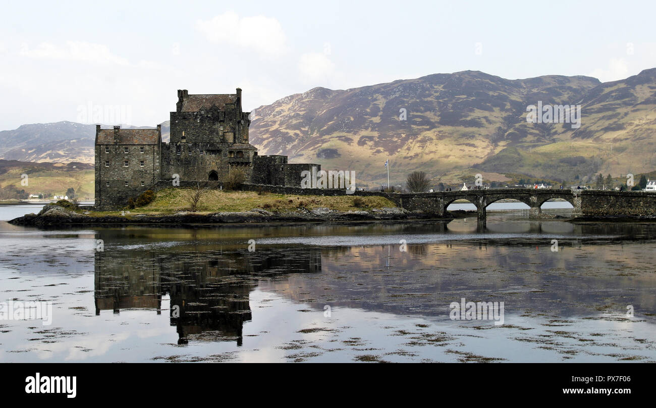 The 13th century Scottish castle, Eilean Donan, sits on a small island ...
