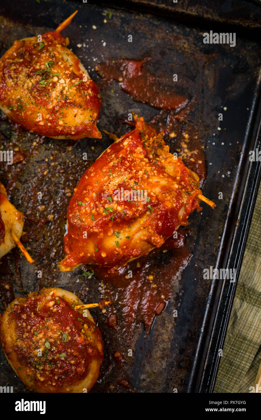 Stuffed Calamari Squid Tubes with Tomato Sauce Stock Photo - Alamy