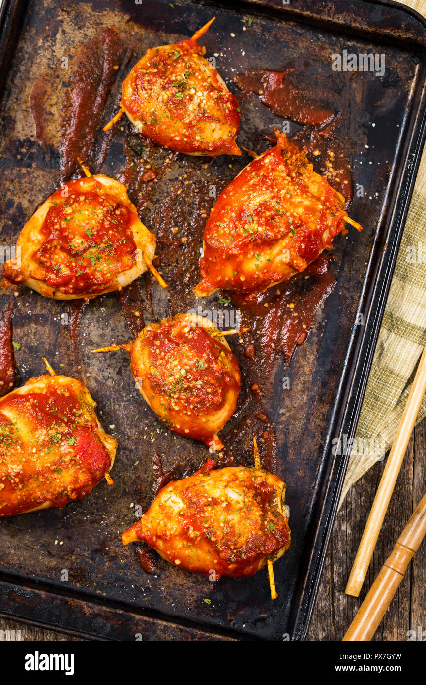 Stuffed Calamari Squid Tubes with Tomato Sauce Stock Photo - Alamy