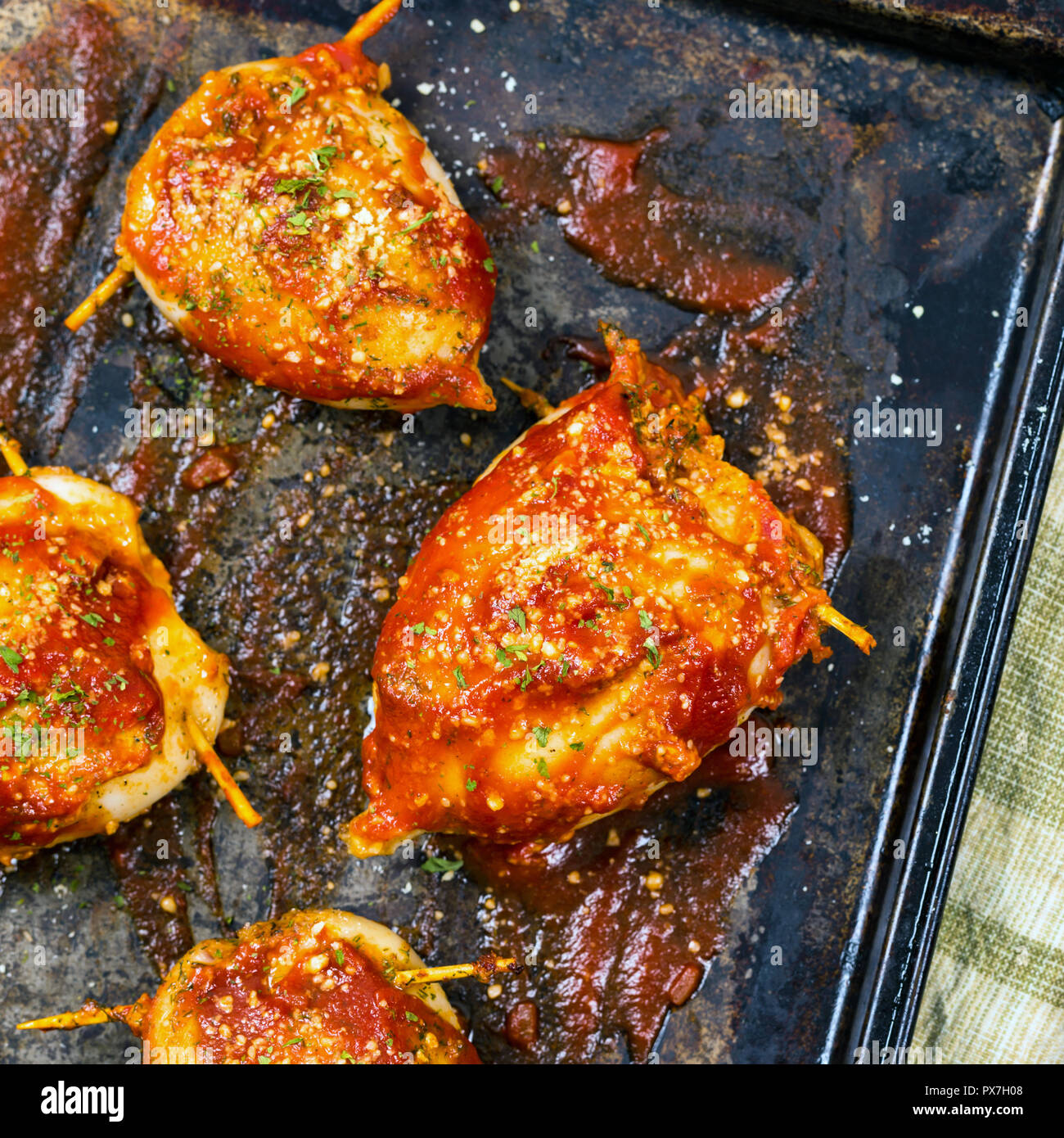 Stuffed Calamari Squid Tubes with Tomato Sauce Stock Photo - Alamy