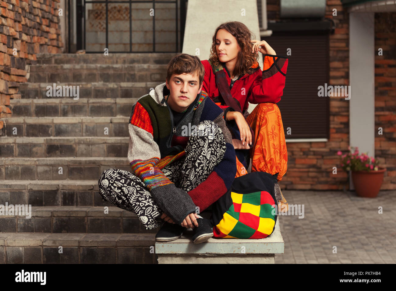Young fashion hippie couple on the steps Stock Photo - Alamy
