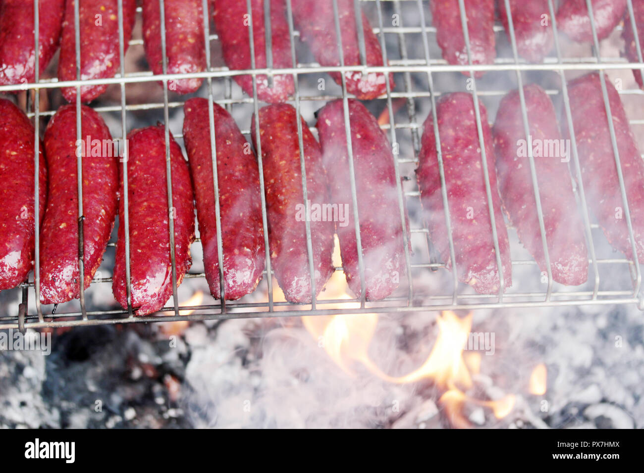 cooking over fire on barbecue grill Stock Photo - Alamy