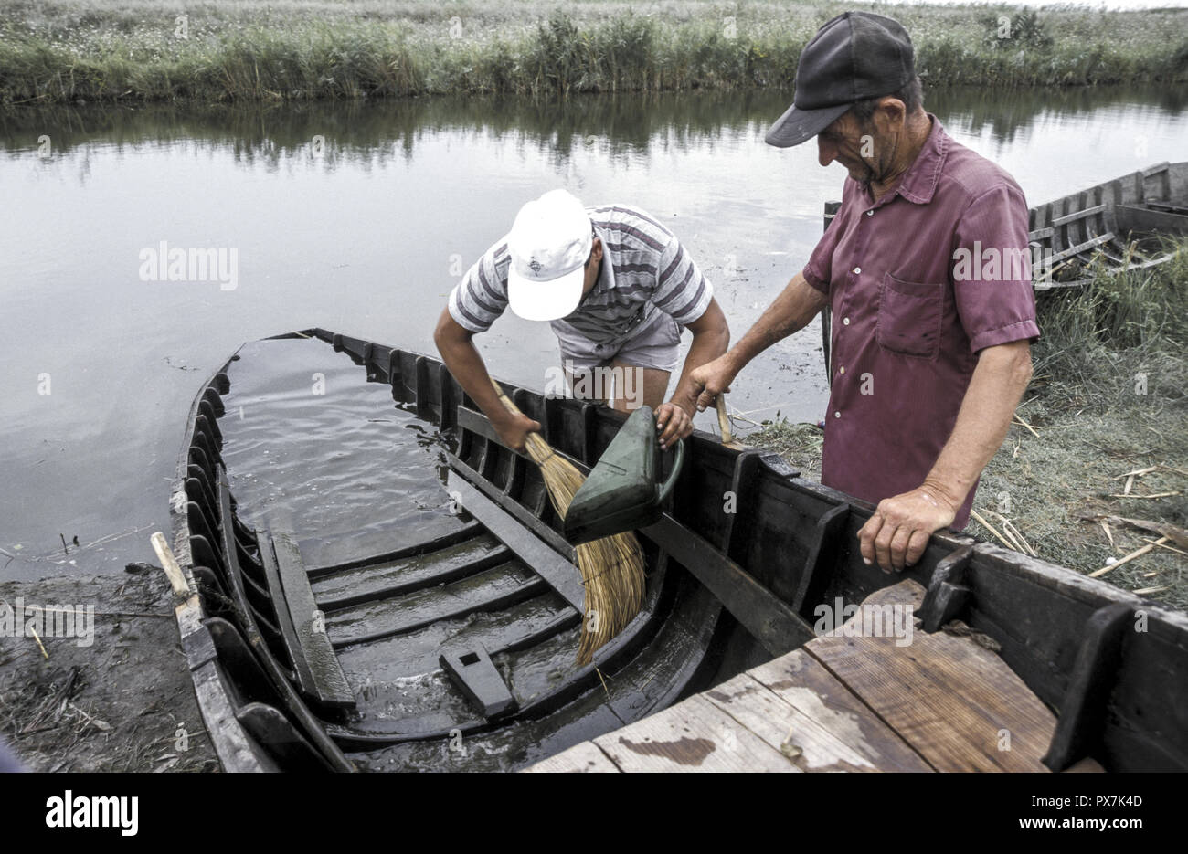 Fisher man, boat, Romania, Danube Delta, Plopu Stock Photo - Alamy