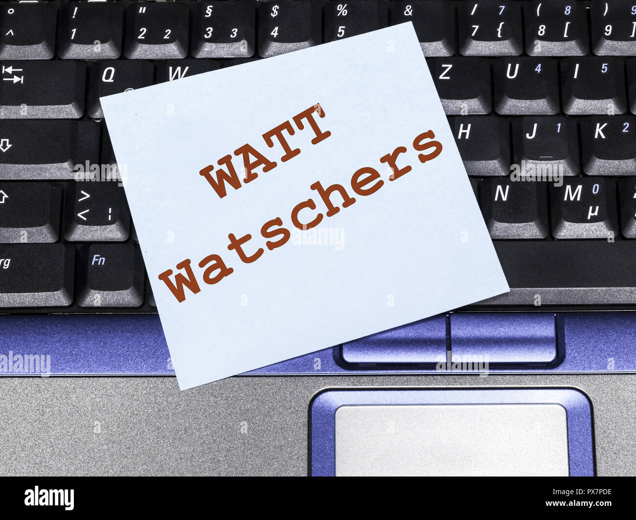 Memo note on notebook, watt watchers Stock Photo - Alamy
