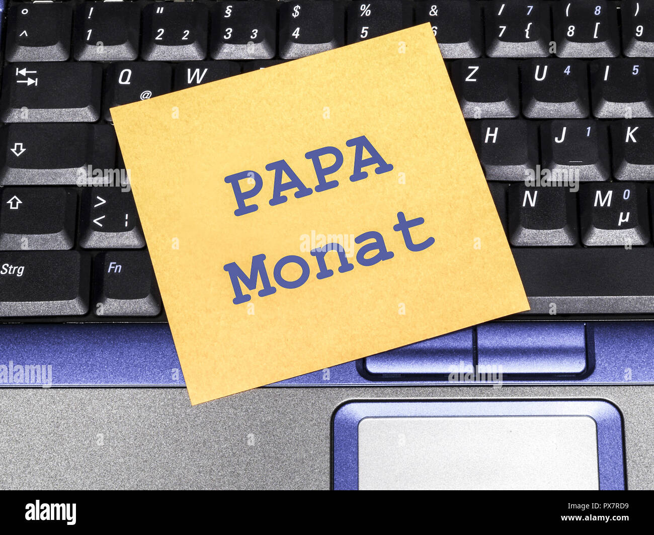Memo note on notebook, papa month Stock Photo - Alamy