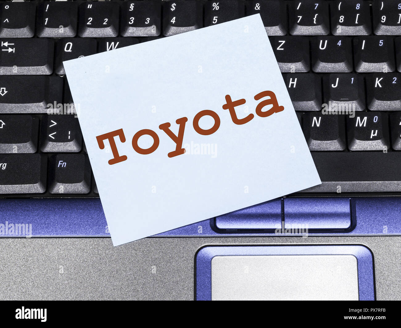 Memo note on notebook, Toyota Stock Photo - Alamy