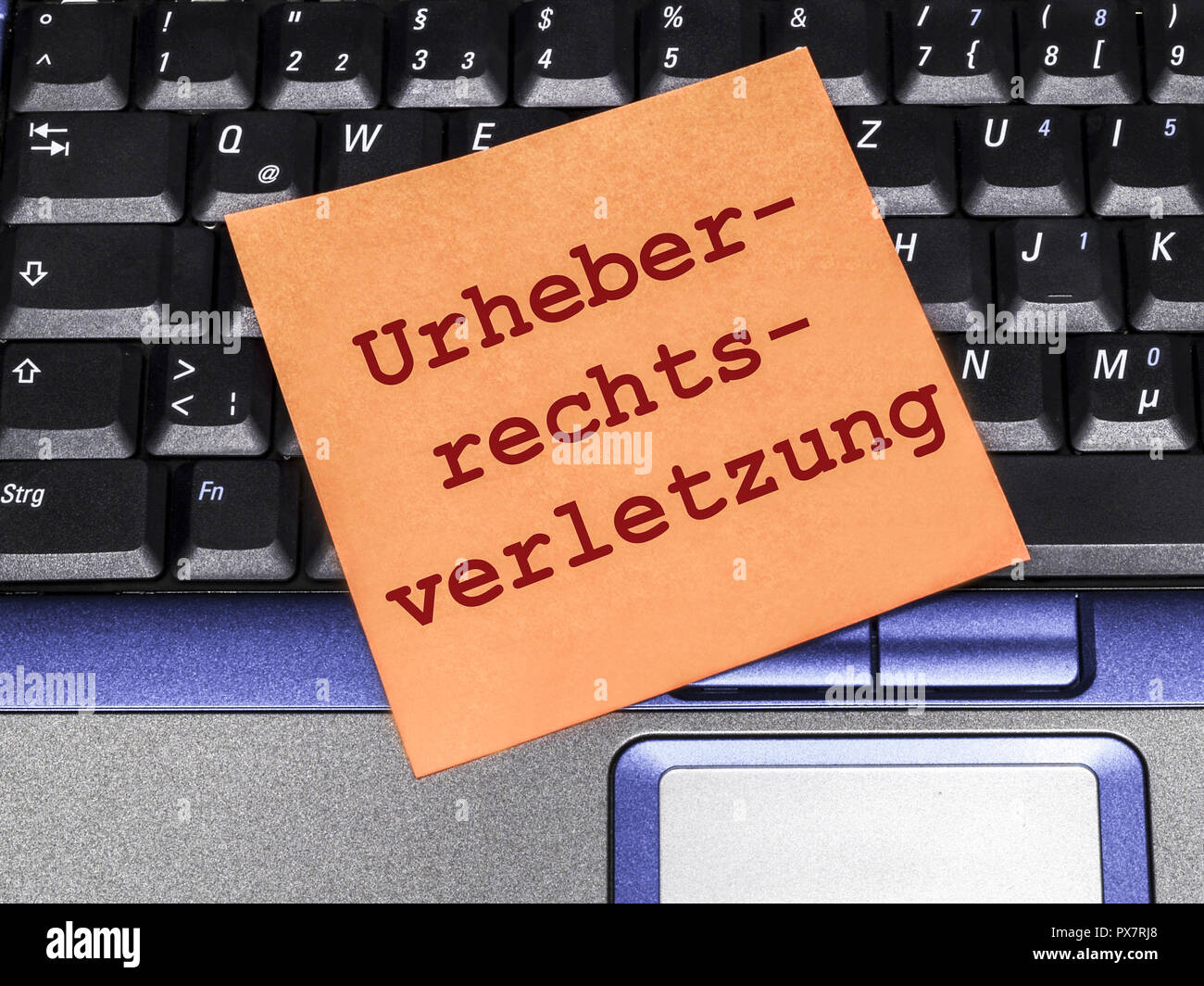 Memo note on notebook, copyright infringement Stock Photo - Alamy