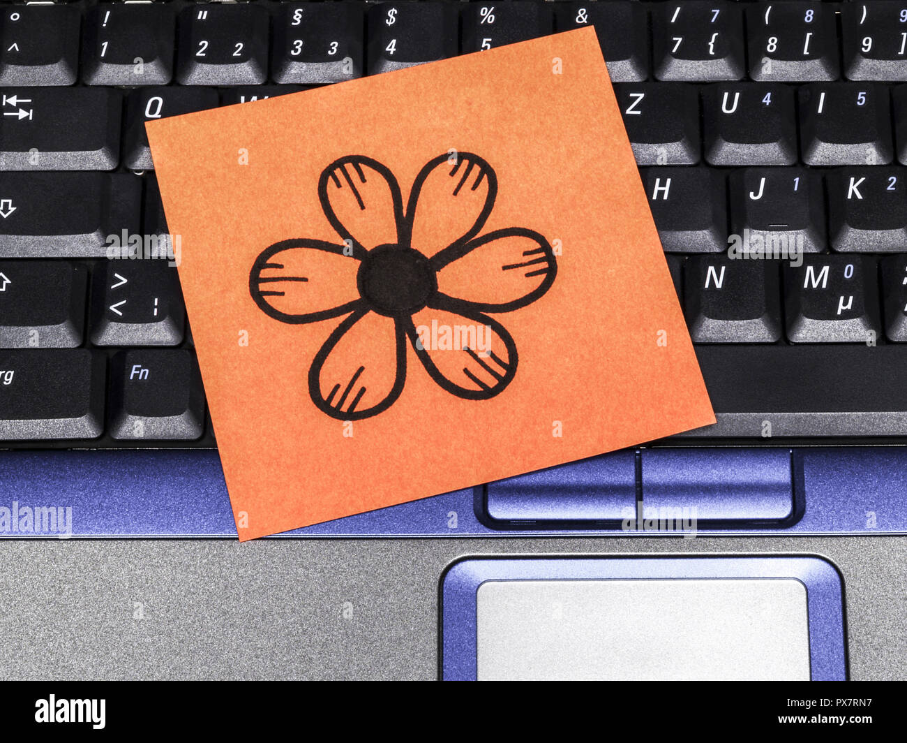 Memo note on notebook, drawing flower Stock Photo - Alamy