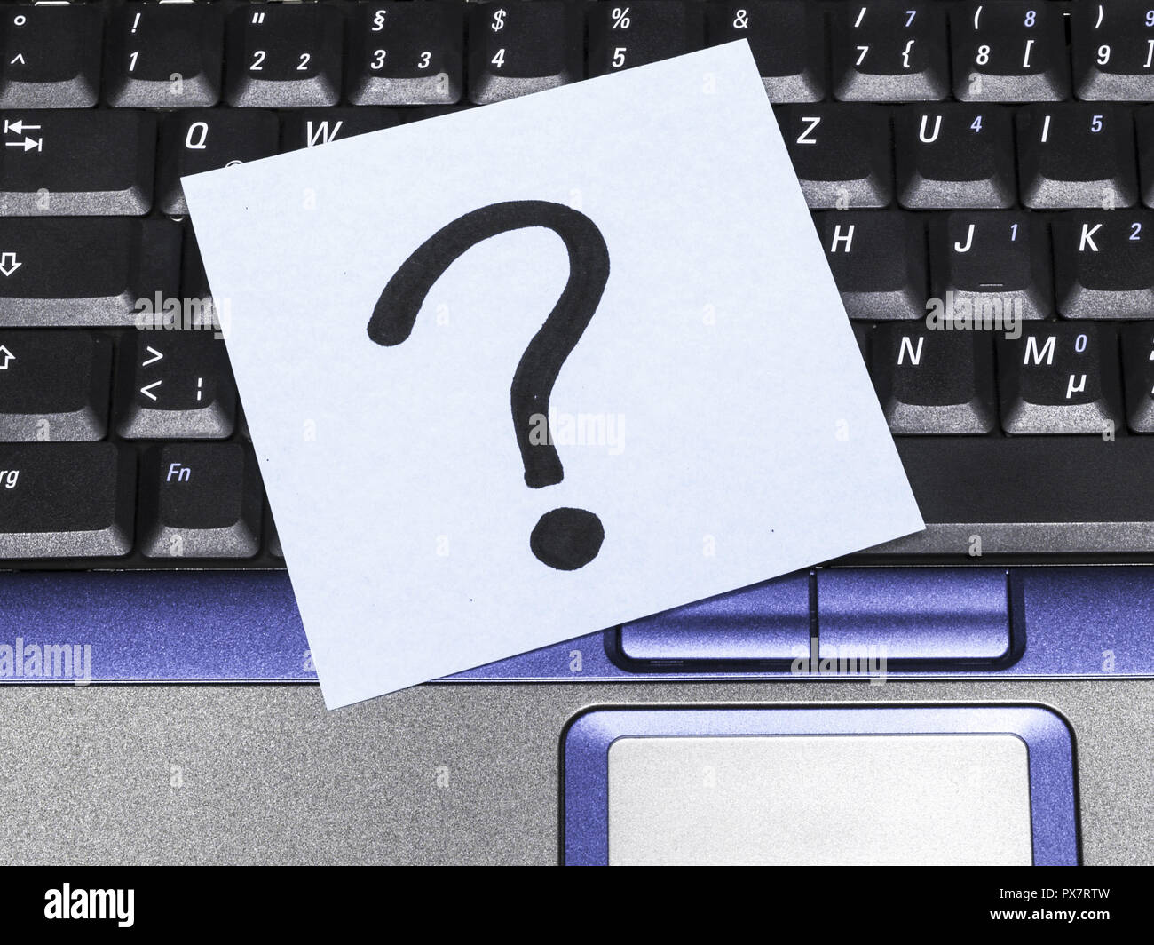 Memo note on notebook, interrogation mark Stock Photo - Alamy