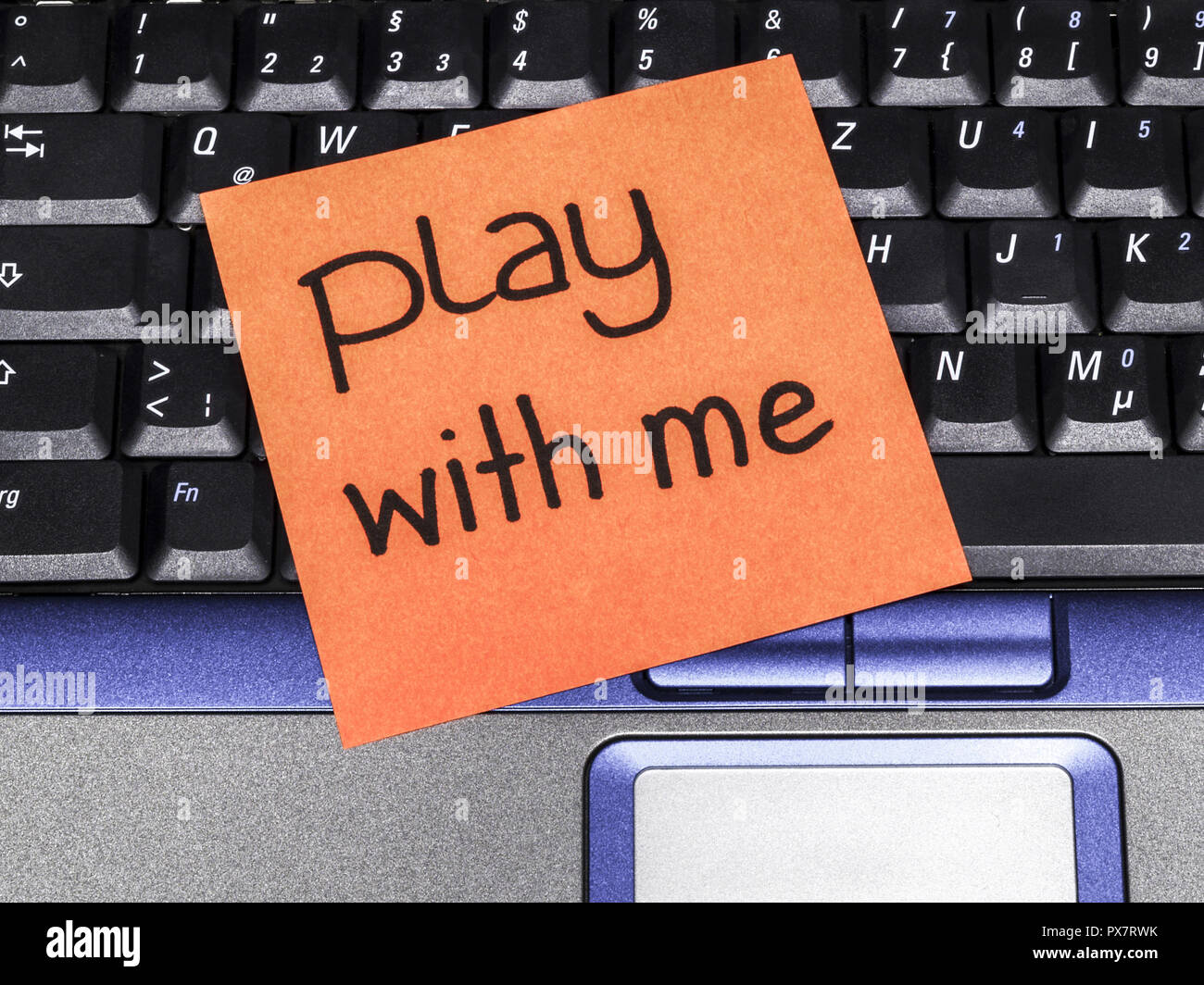 Memo note on notebook, play with me Stock Photo - Alamy