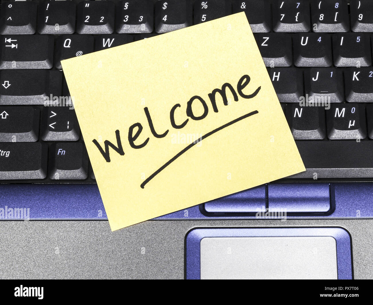Memo note on notebook, welcome Stock Photo - Alamy