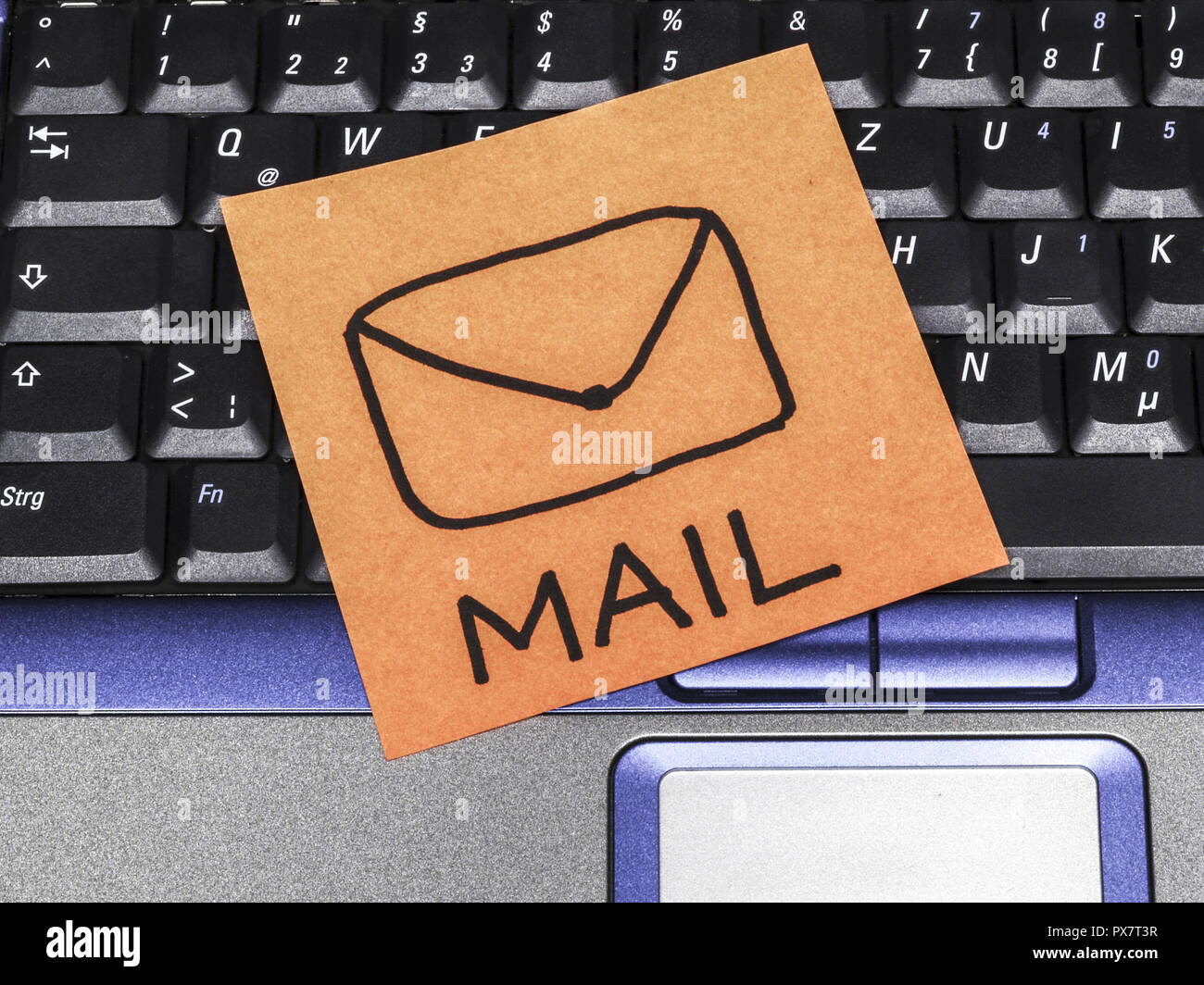 Memo note on notebook, drawing mail Stock Photo - Alamy
