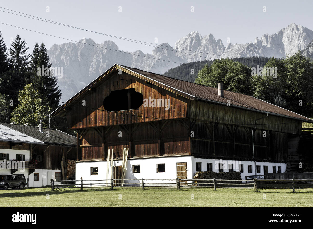 Traditional farmhouse with mountains in the back, Austria, Tyrol Stock ...