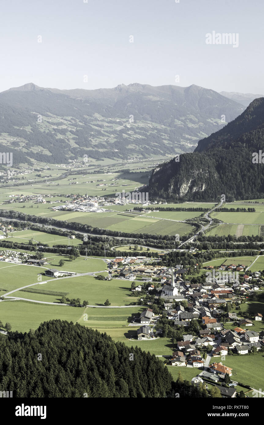 Village in a valley in a hilly landscape, Austria, Tyrol, Inn valley ...