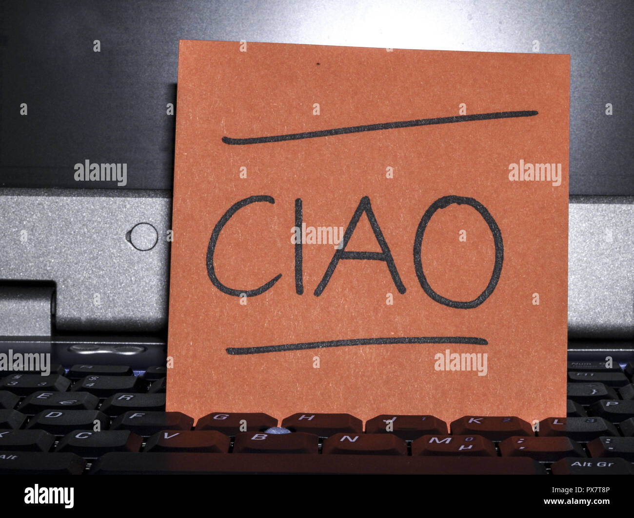 Memo note on notebook, ciao, bye Stock Photo - Alamy