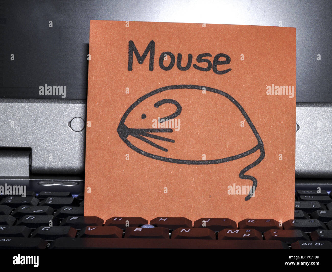 Memo note on notebook, mouse drawing computer mouse Stock Photo - Alamy