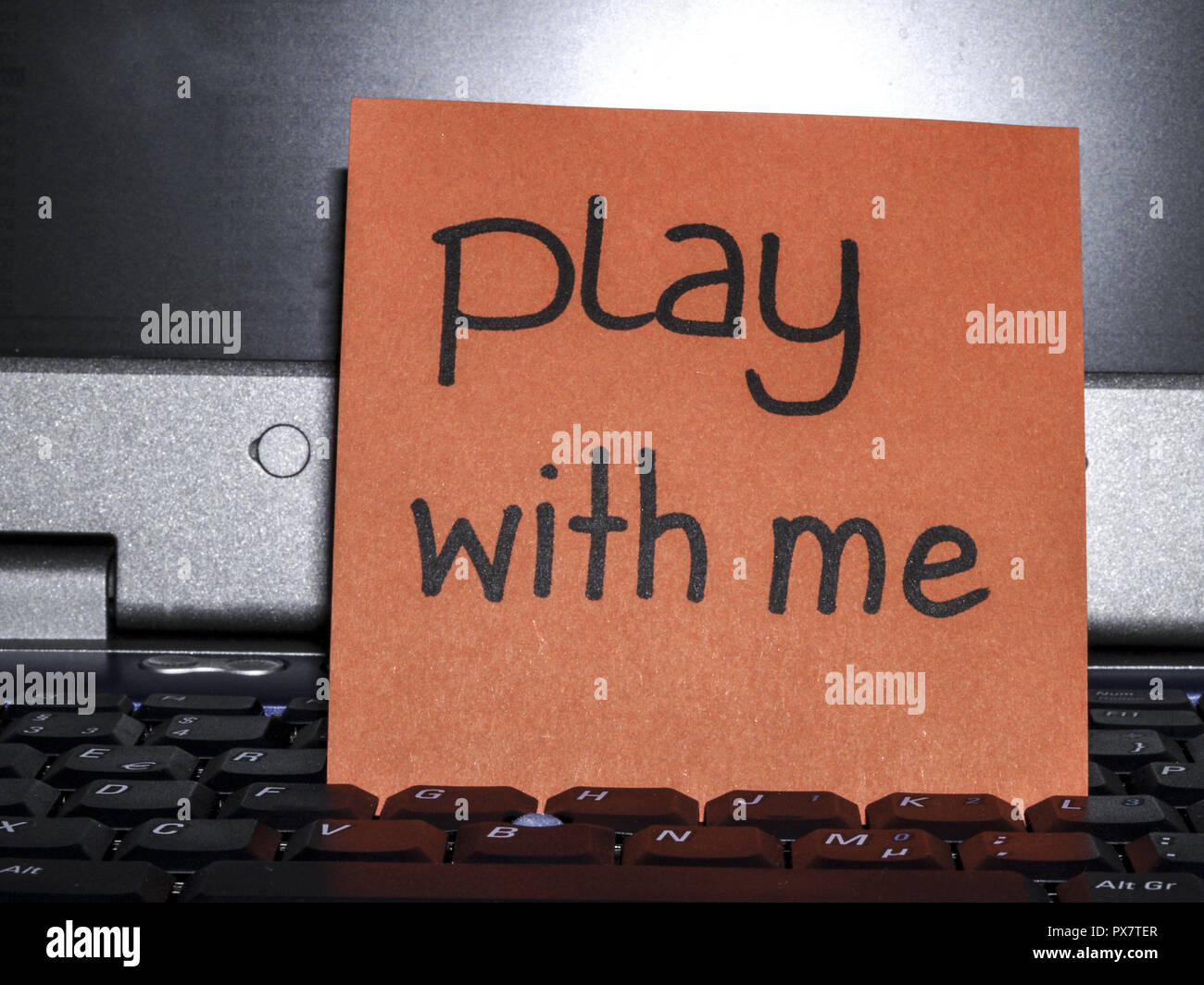 Memo note on notebook, play with me Stock Photo - Alamy