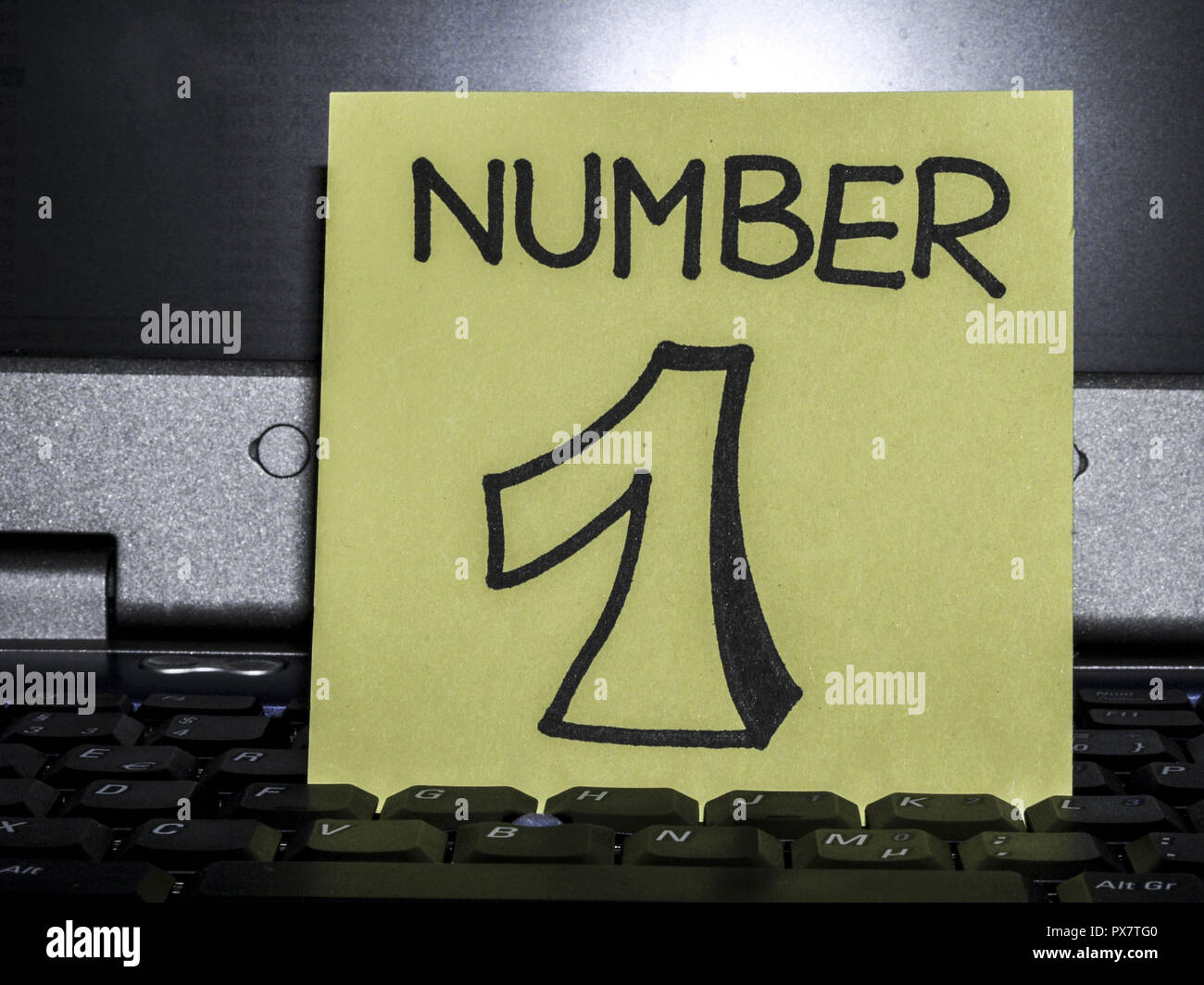 Memo note on notebook, number one Stock Photo - Alamy