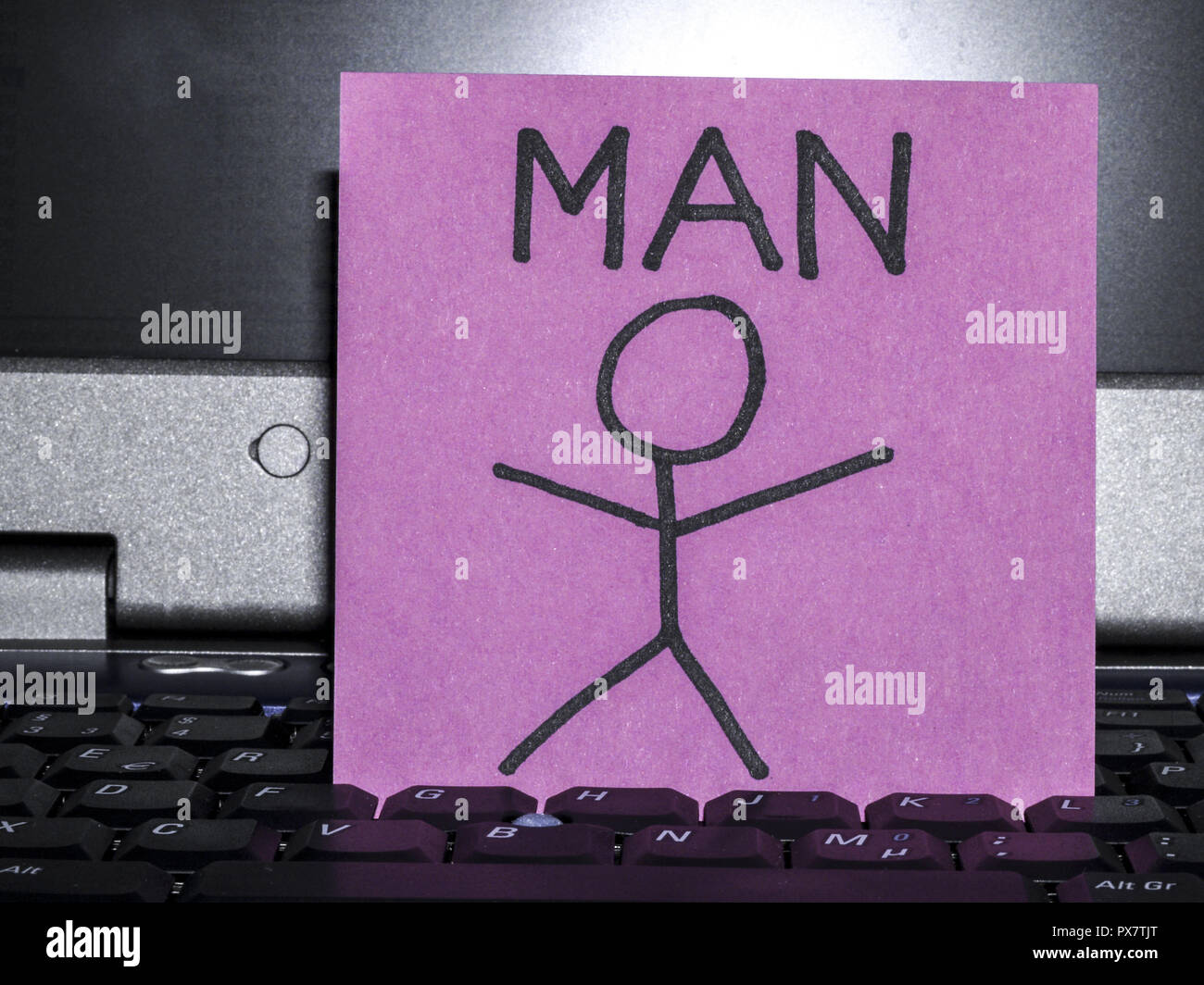 Memo note on notebook, drawing man Stock Photo - Alamy