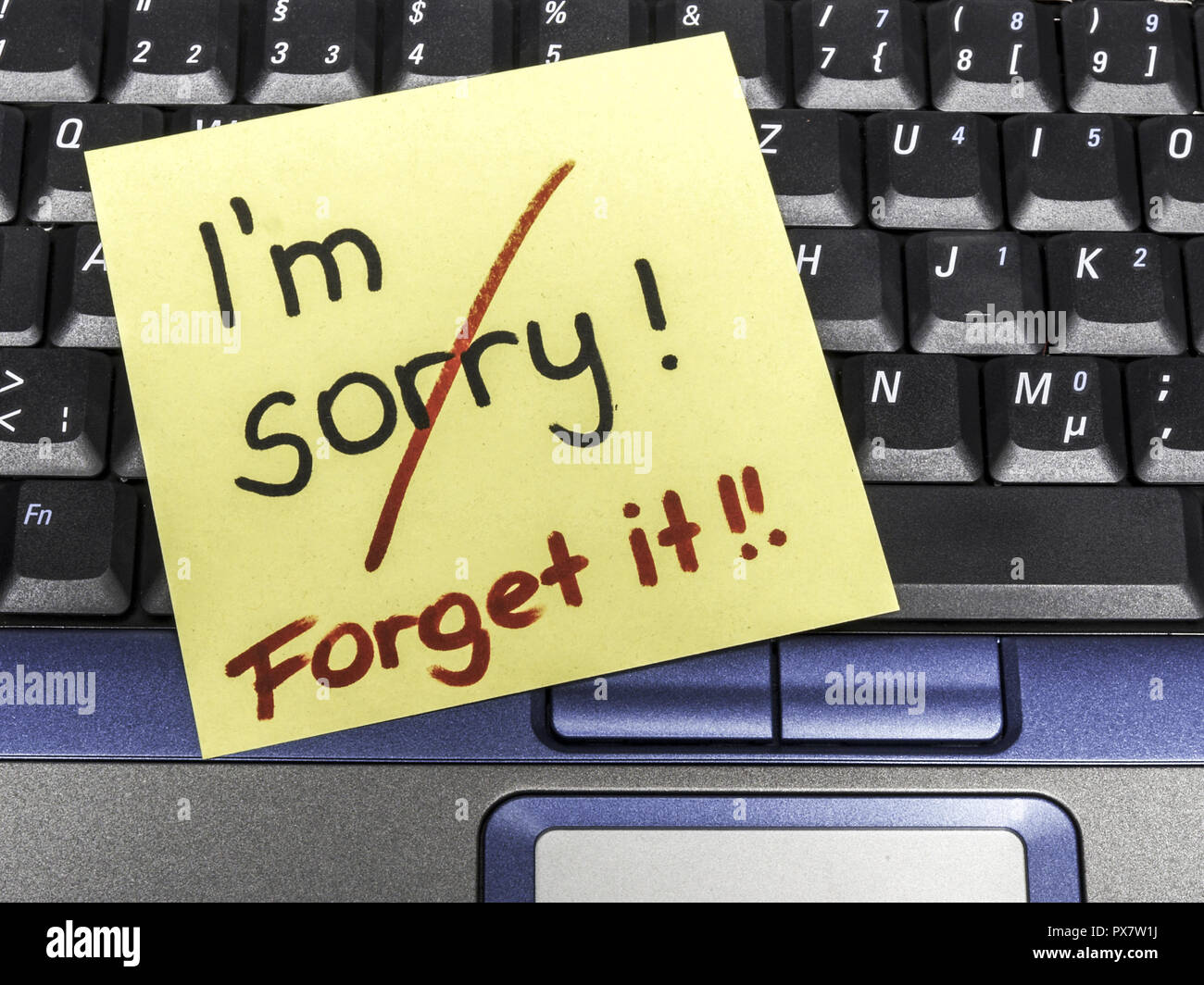 Memo note on notebook, I´m sorry, forget it Stock Photo - Alamy