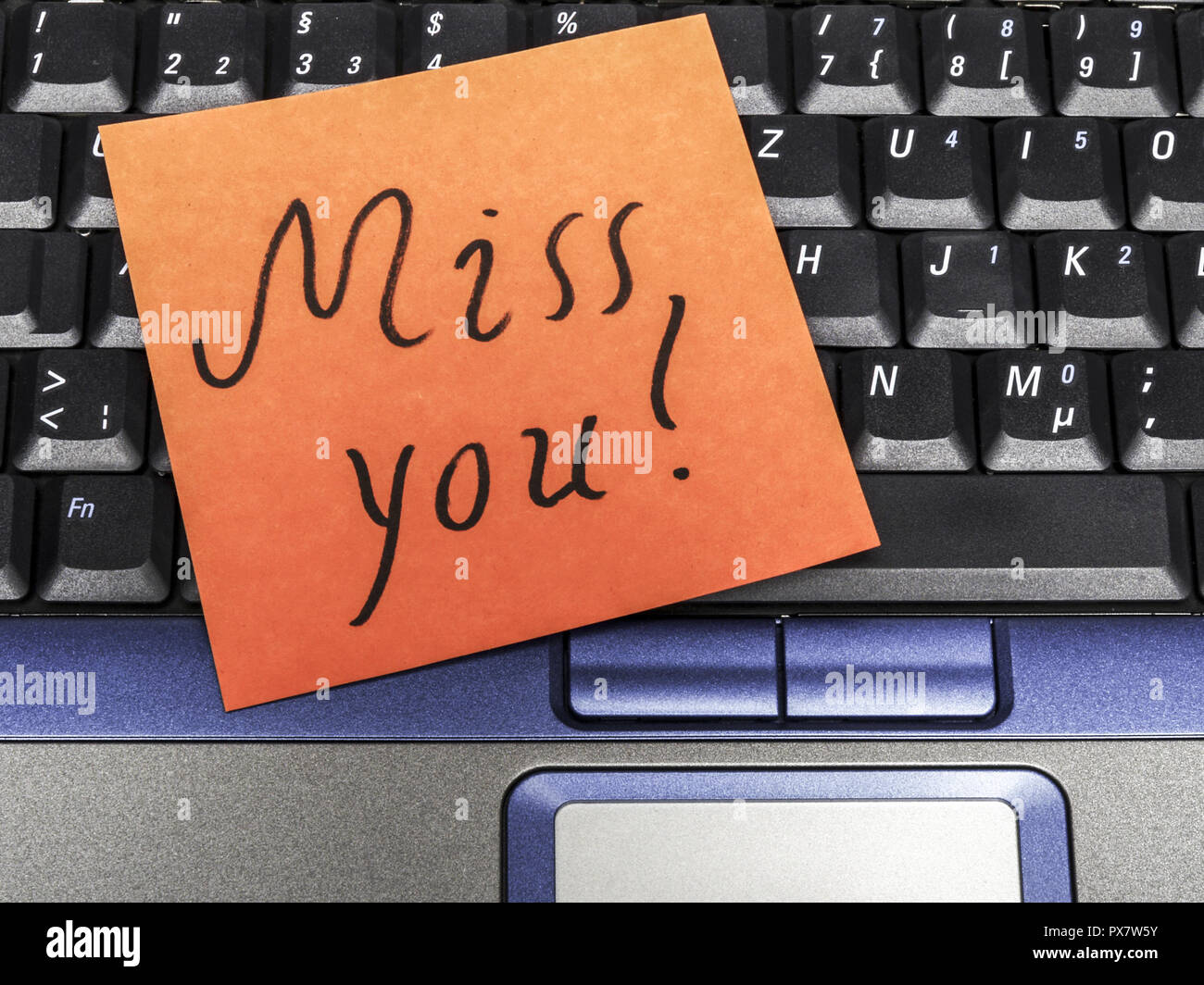 Memo note on notebook, miss you Stock Photo - Alamy