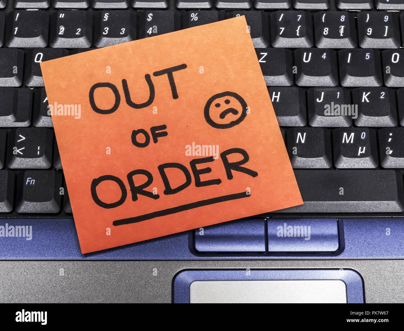 Memo note on notebook, out of order Stock Photo - Alamy