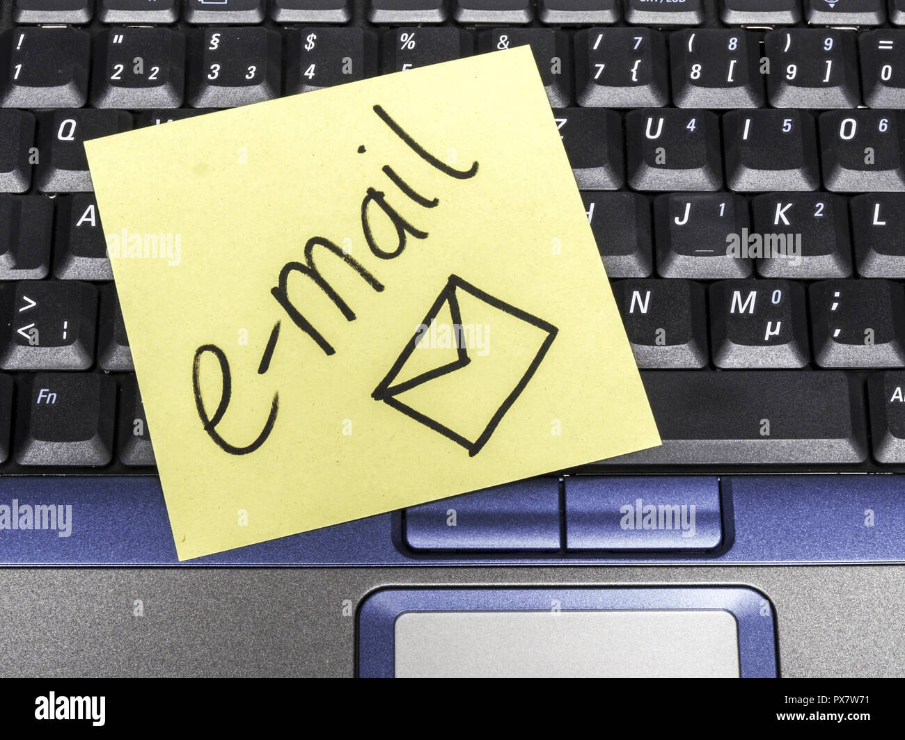 Memo note on notebook, e-mail with drawing of an envelope Stock Photo ...