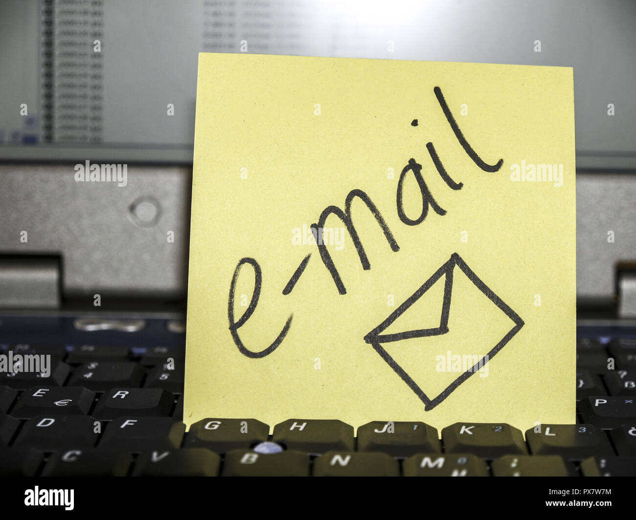 Memo note on notebook, e-mail with drawing of an envelope Stock Photo ...