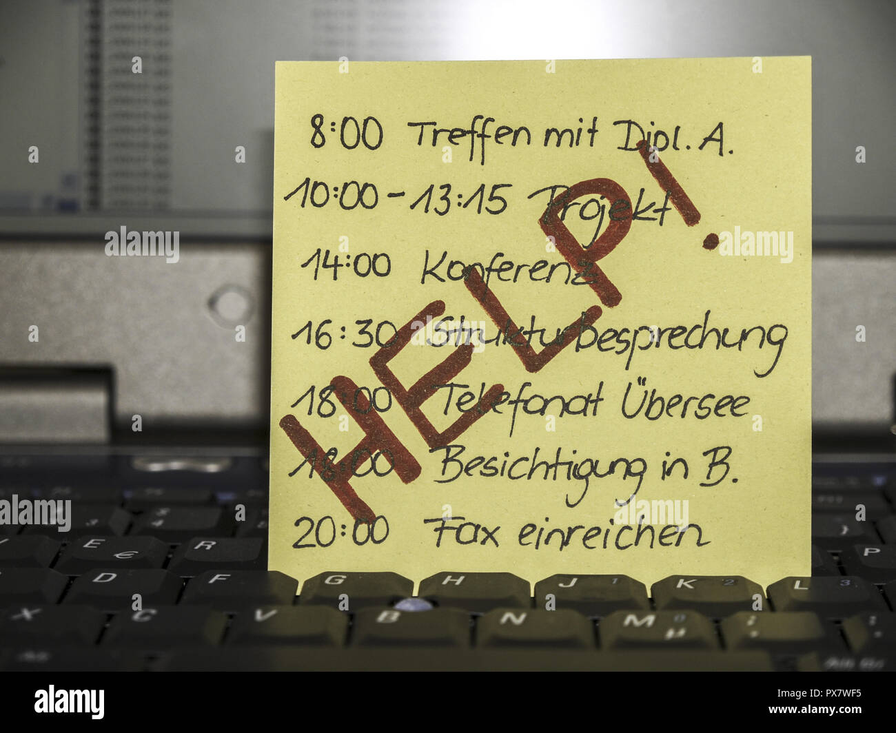 Memo note on notebook, day´s schedule with sign Help Stock Photo - Alamy