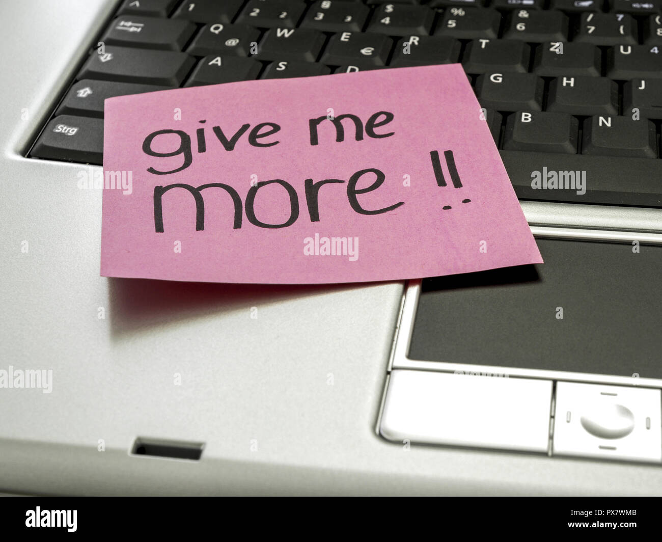 Memo note on notebook, give me more Stock Photo - Alamy