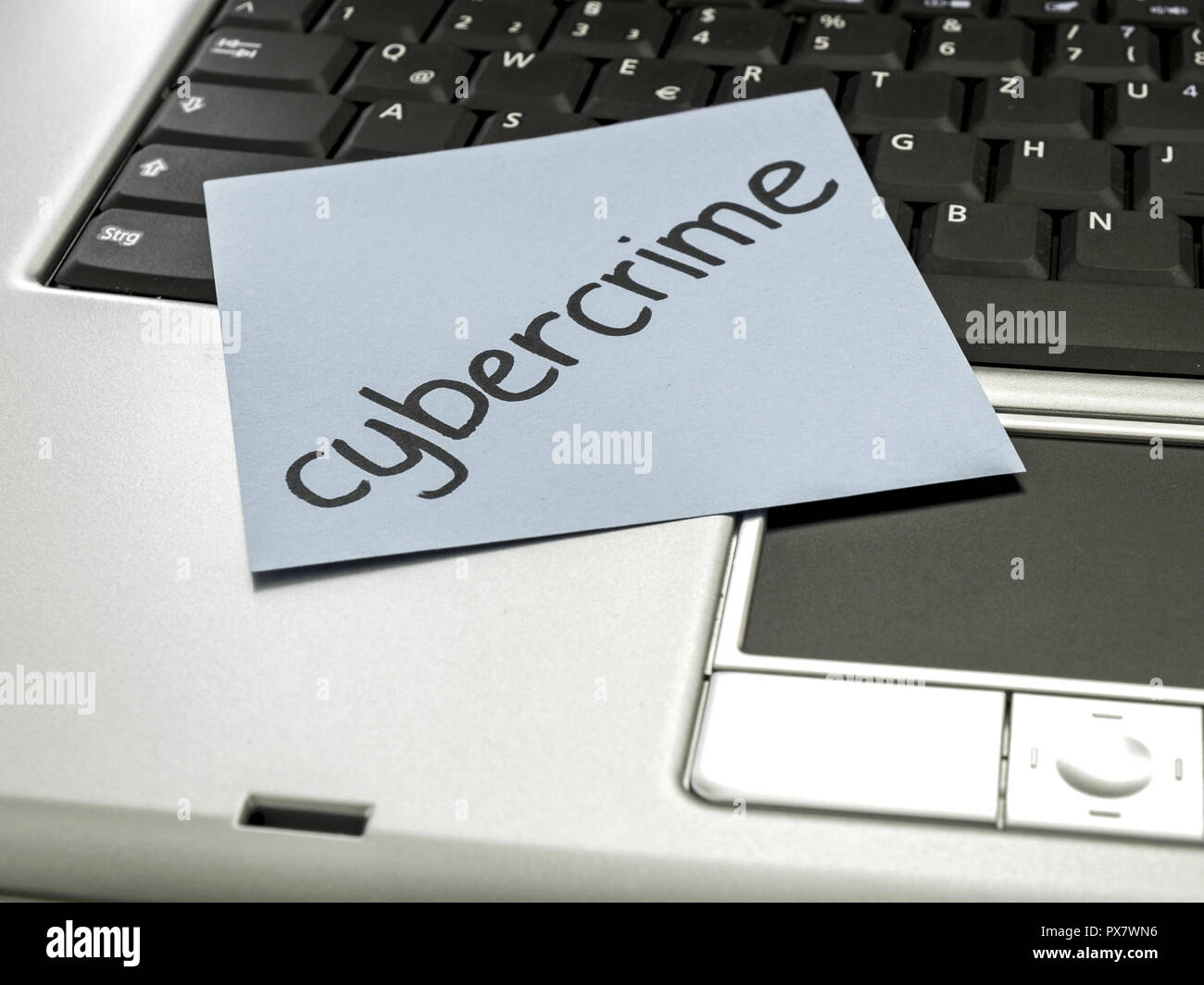 Memo note on notebook, cybercrime Stock Photo - Alamy