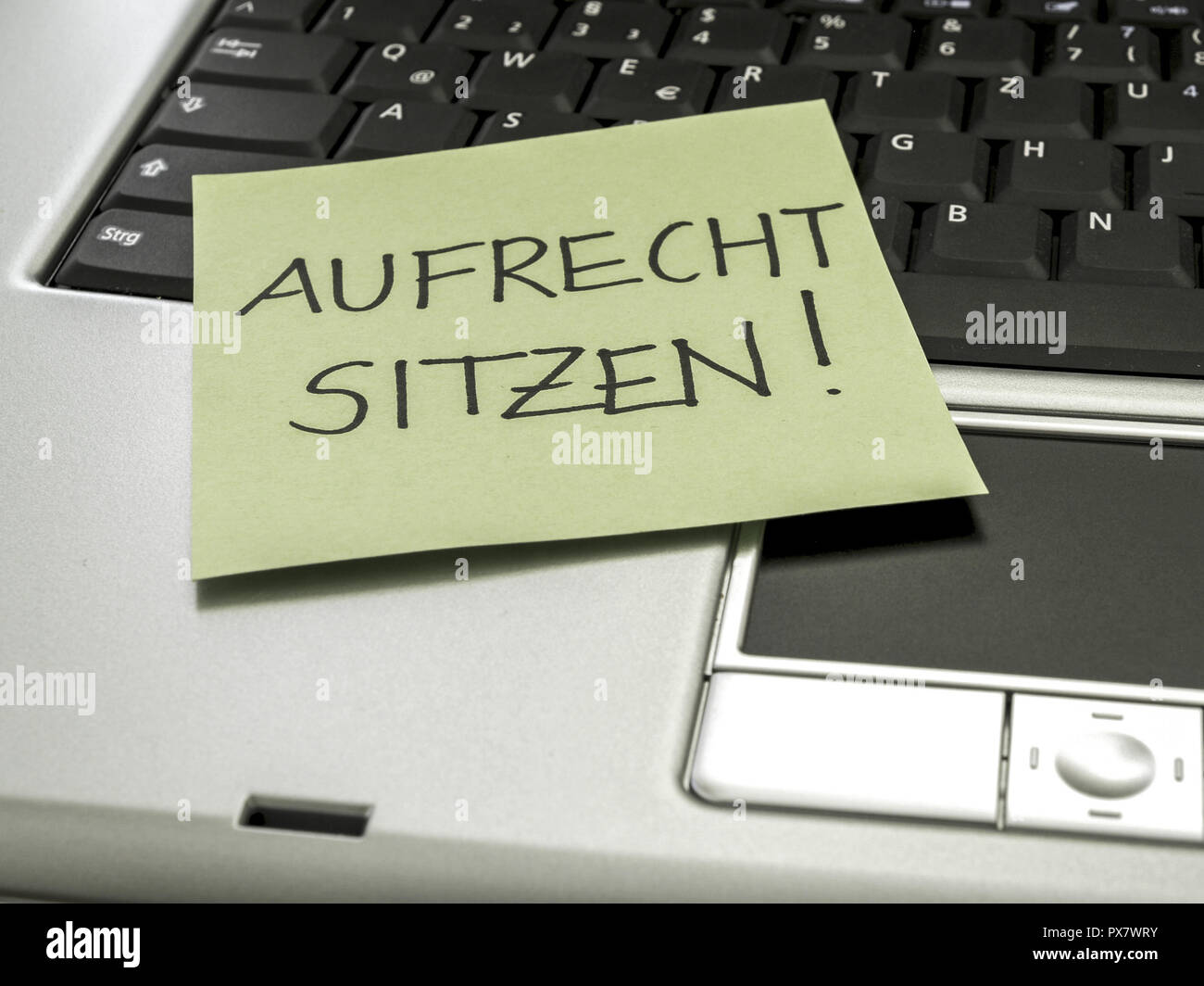 Memo note on notebook, sit straight Stock Photo - Alamy