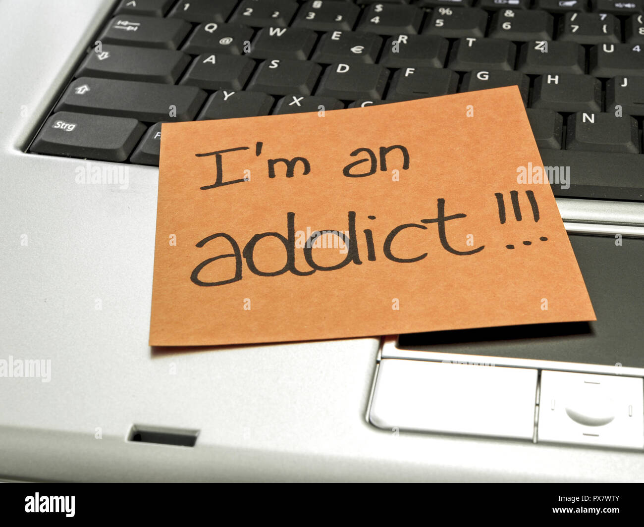 Memo note on notebook, I´m an addict Stock Photo - Alamy