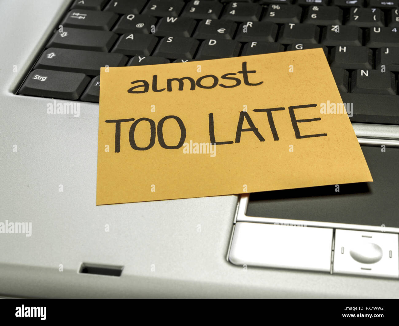 Memo note on notebook, almost too late Stock Photo - Alamy