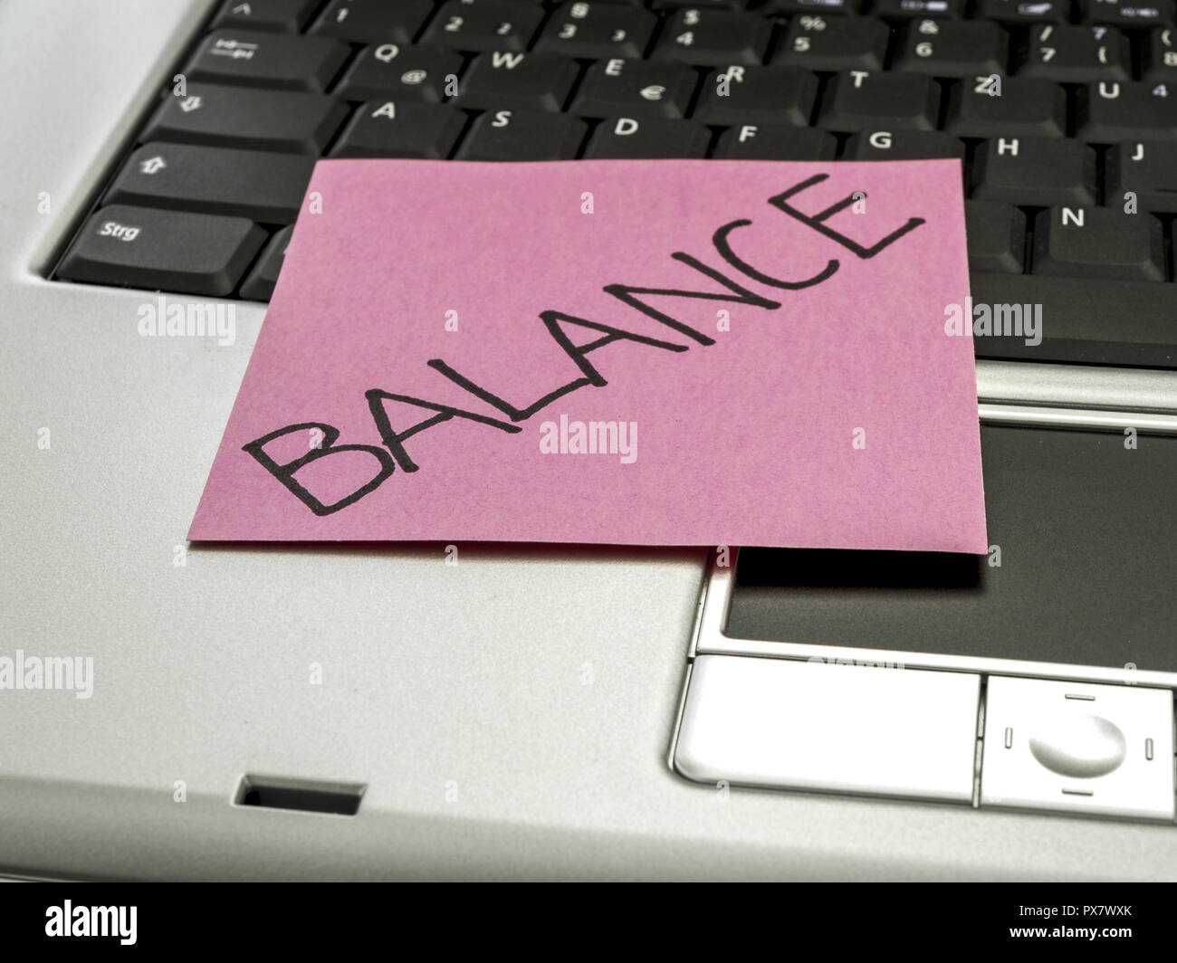 Memo note on notebook, balance Stock Photo - Alamy
