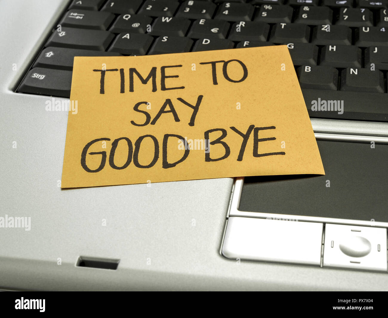 Memo note on notebook, time to say goodbye Stock Photo - Alamy